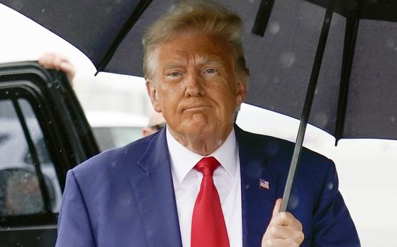 File —former President Donald Trump Walks To Speak With Reporters