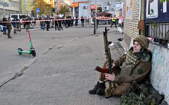 A Ukrainian Serviceman Watches The Sky During A Drone Attack In Kyiv On